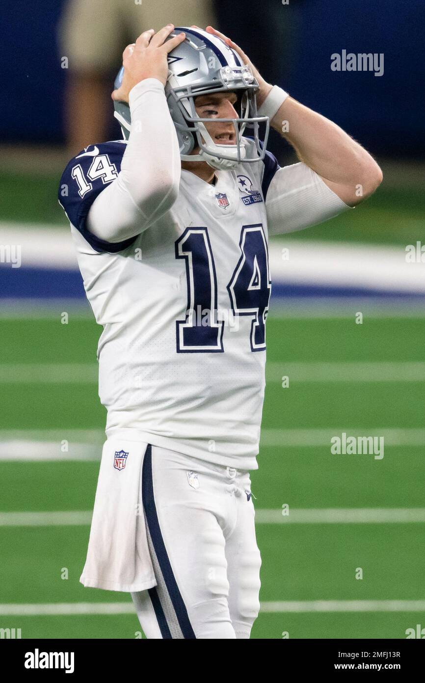 Dallas Cowboys quarterback Andy Dalton (14) reacts to a dropped pas in ...