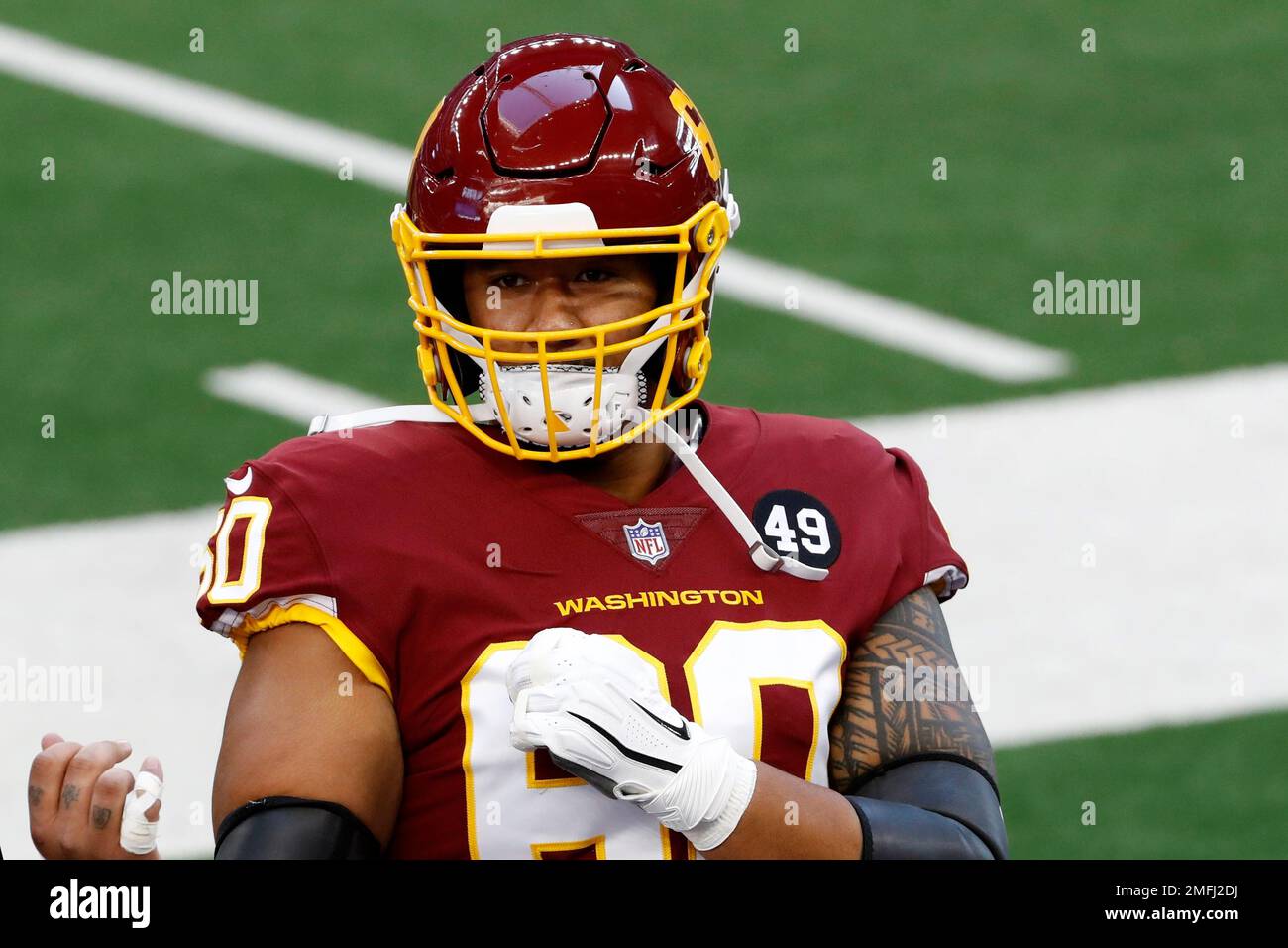 Washington Football Team center Keith Ismael (60) warms up before ...