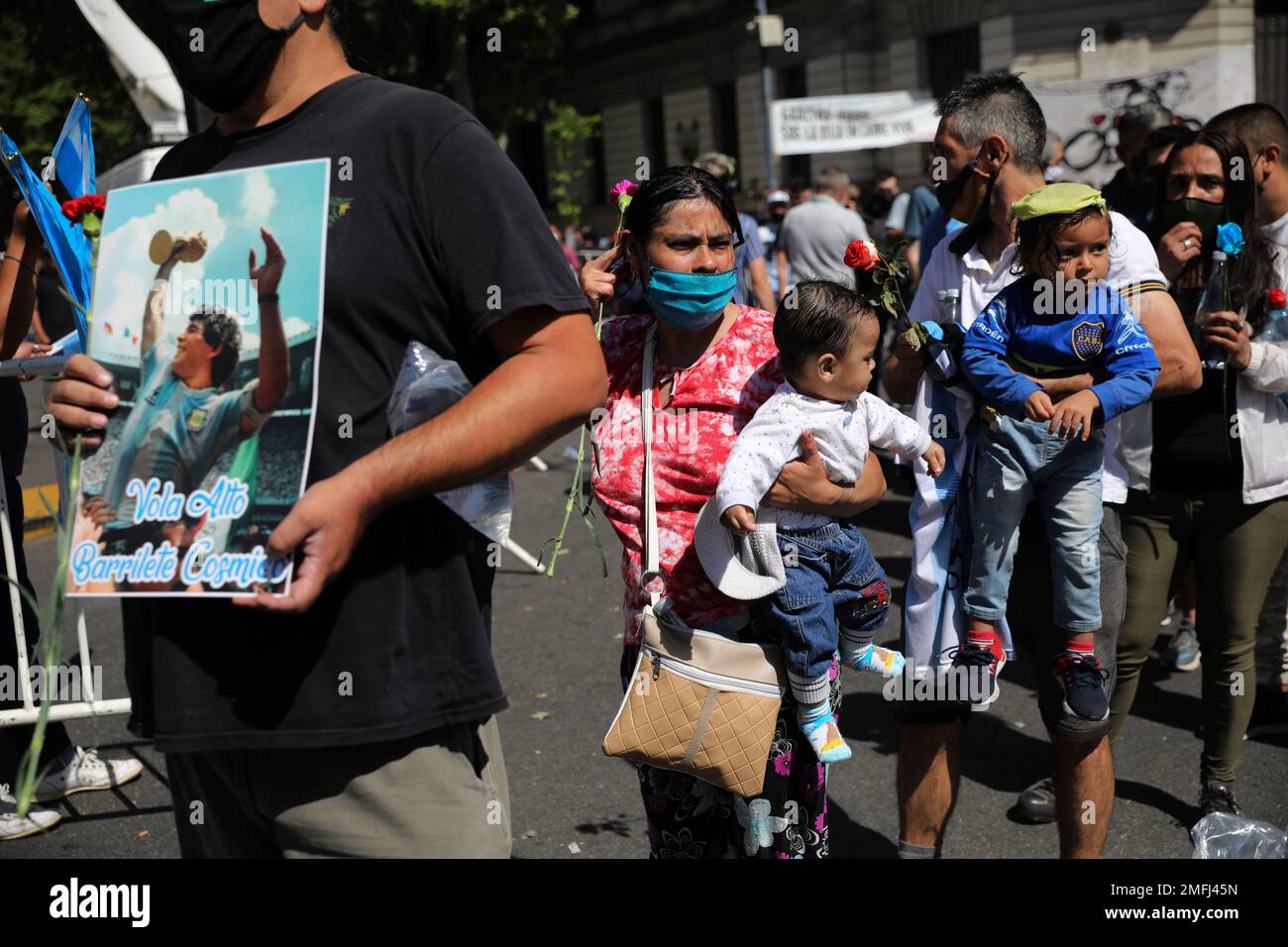 Mourners line up to pay their final respects to Diego Maradona, outside ...