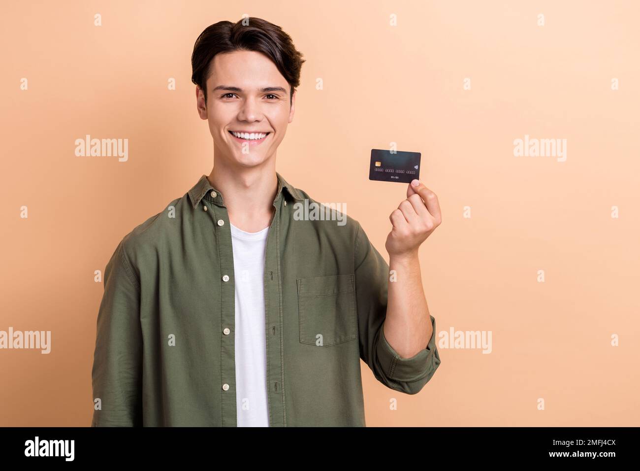 Photo of nice positive person beaming smile arm hold plastic debit card ...