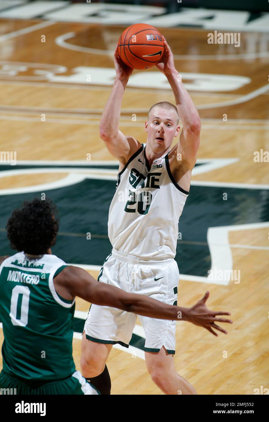 Michigan State's Joey Hauser (20), looks to pass against Eastern ...