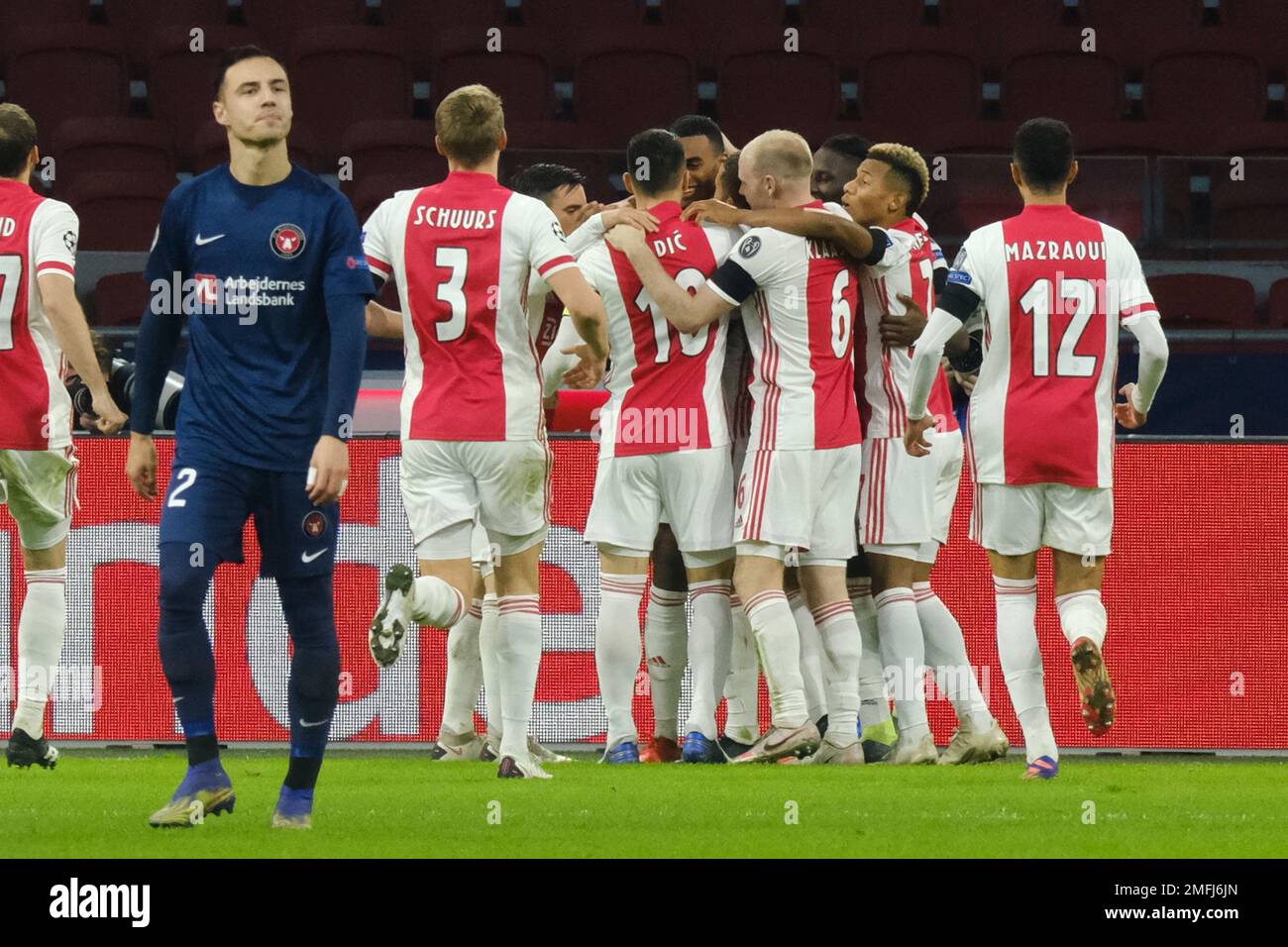 Ajax players celebrate scoring their side's first goal during the group ...