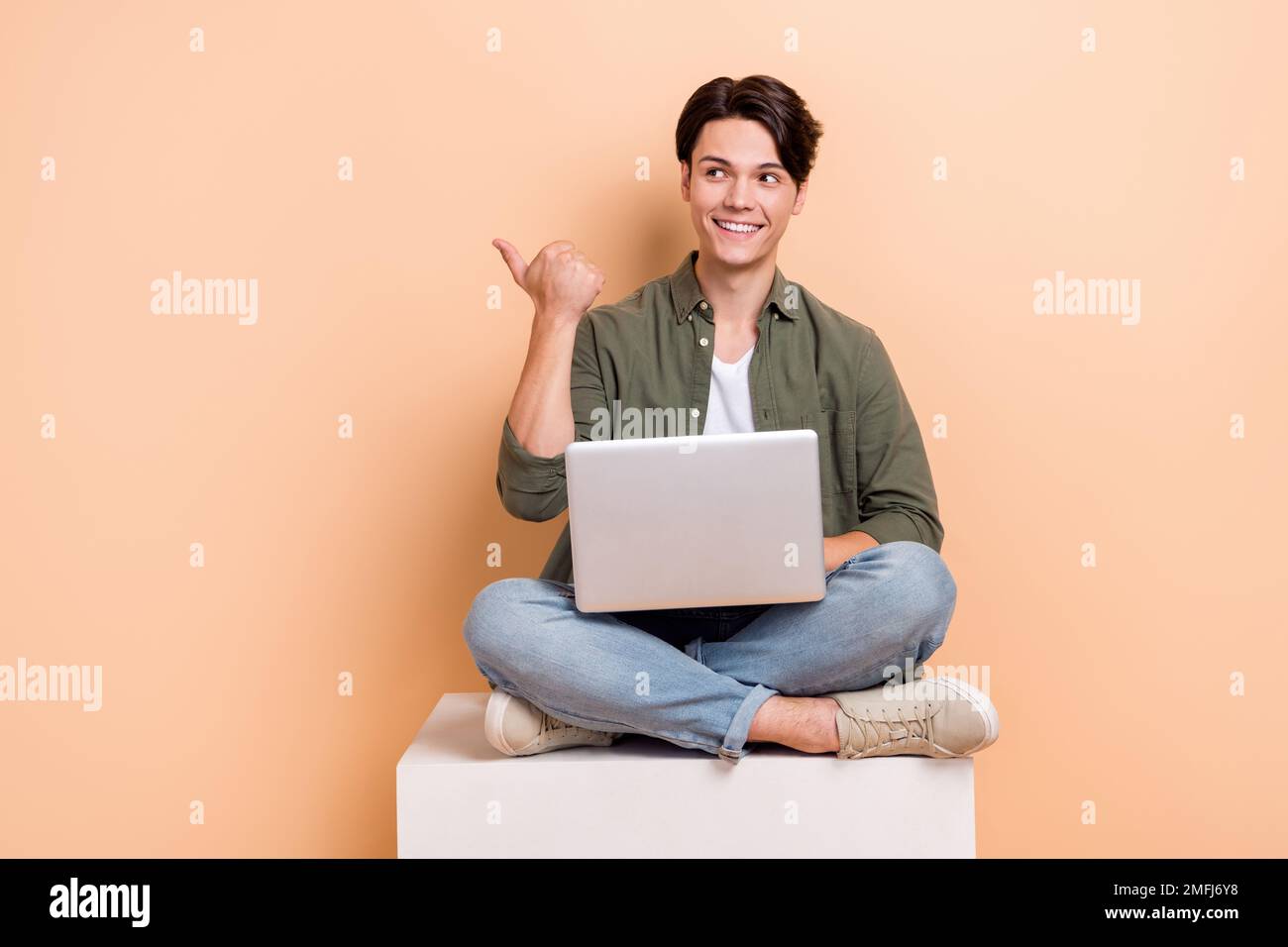 Full body photo cadre of young optimistic it developer guy sitting with ...