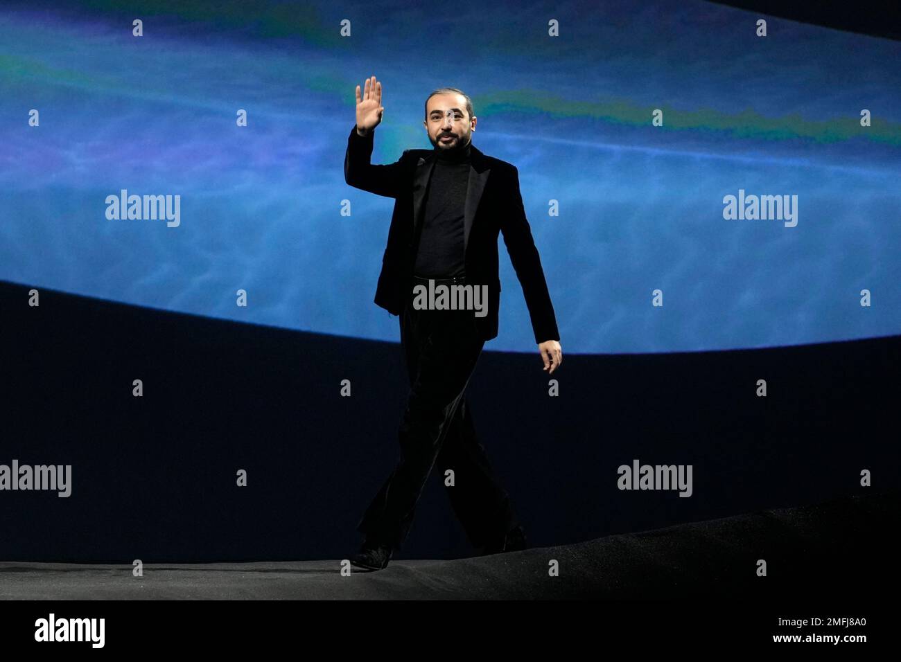 Paris-based Saudi Arabia designer Mohammed Ashi accepts applause after ...