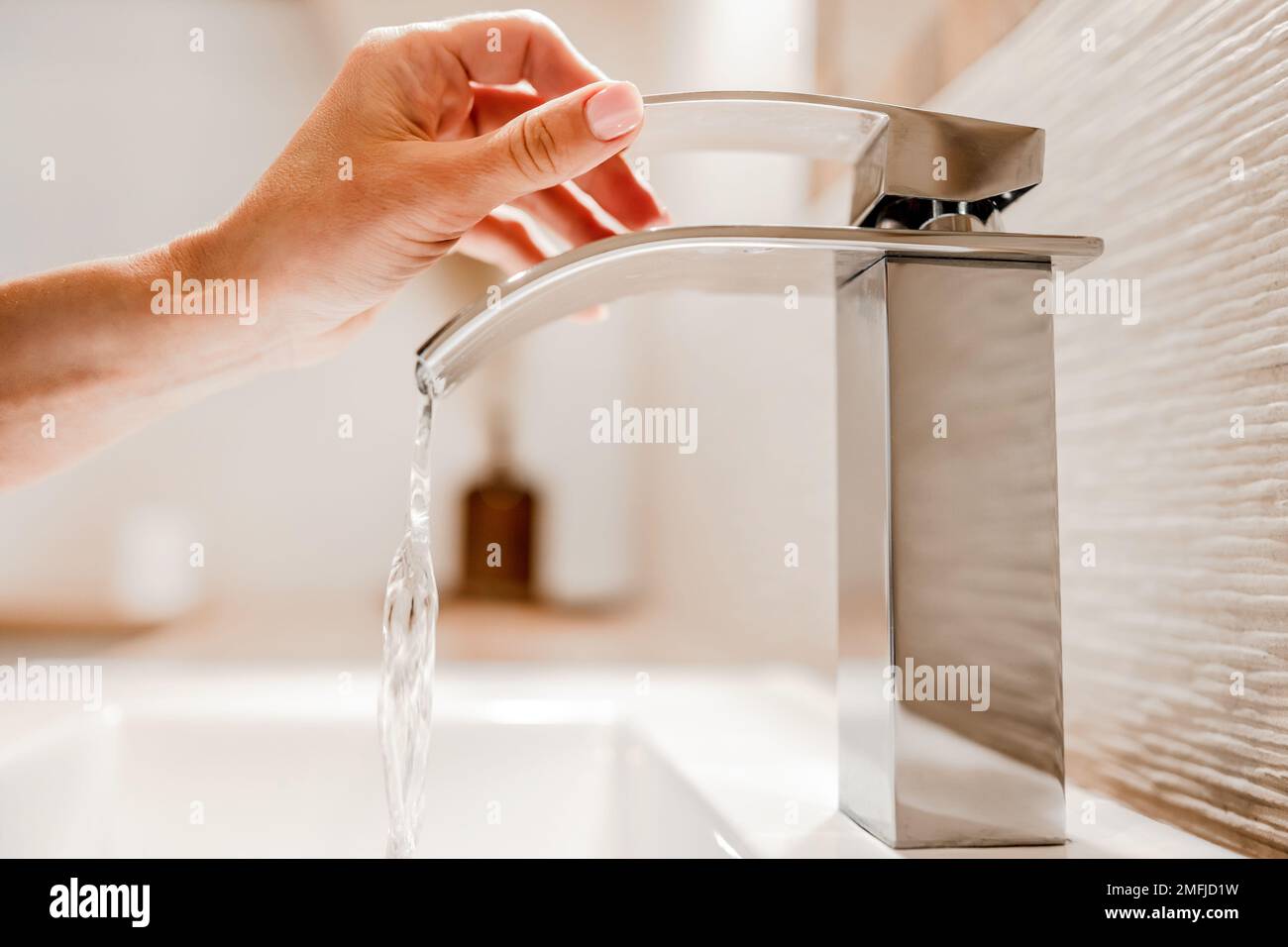 Hand in clear running water hi-res stock photography and images - Alamy