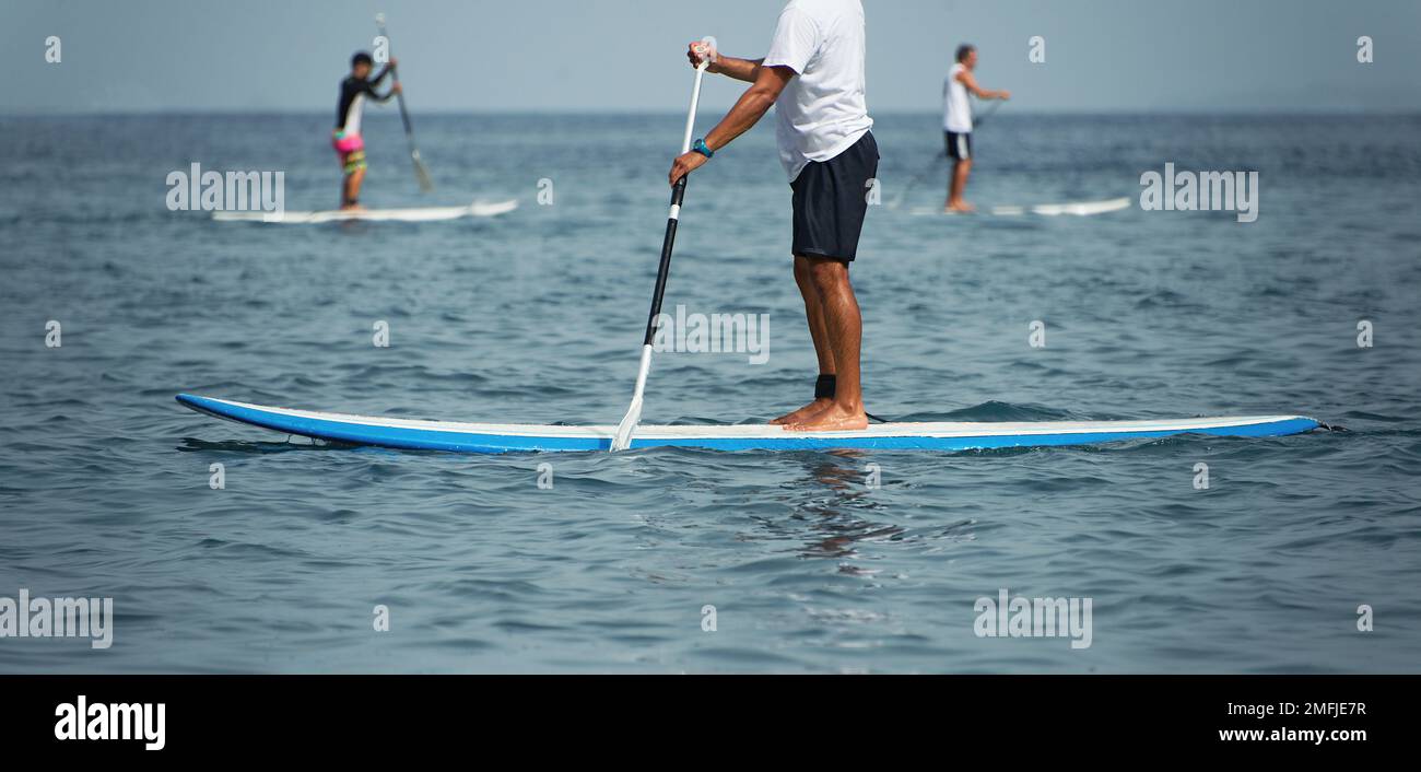 Stand up paddle group on the sea Stock Photo - Alamy