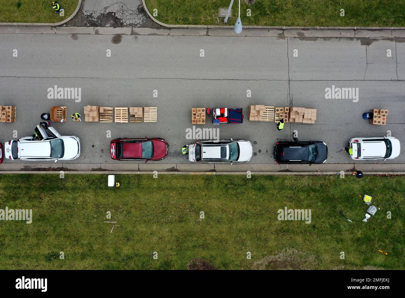 Volunteers load boxes of food into a car during a Greater Pittsburgh ...