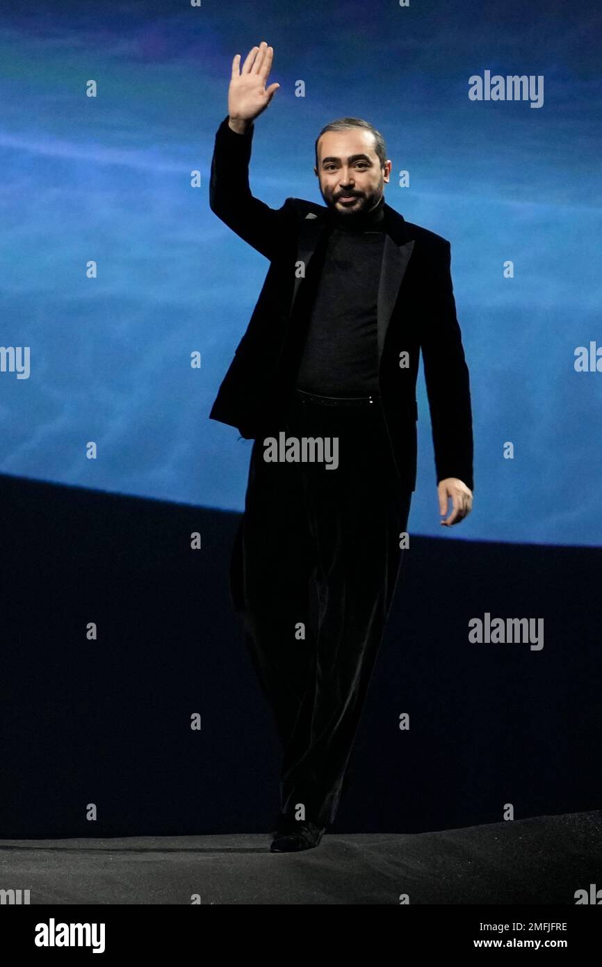 Paris-based Saudi Arabia designer Mohammed Ashi accepts applause after ...