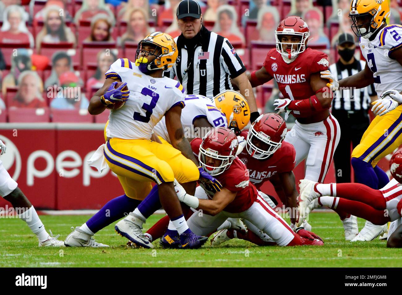 LSU running back Tyrion Davis-Price (3) tries to get past Arkansas ...