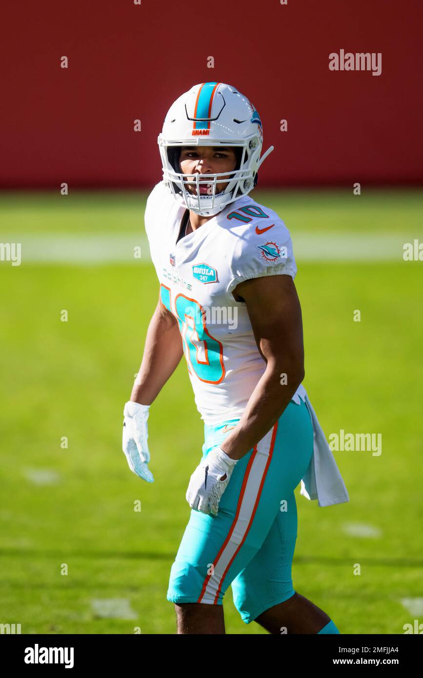 Miami Dolphins running back Malcolm Perry (10) warms up /C? before an ...