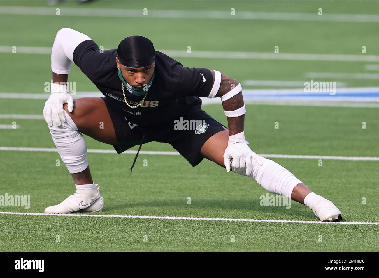 New York Jets cornerback Arthur Maulet (23) stretches before an NFL ...