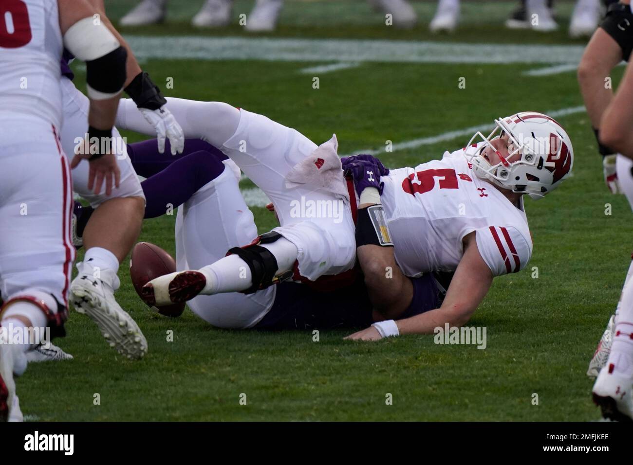 Wisconsin quarterback Graham Mertz is sacked by Northwestern linebacker ...