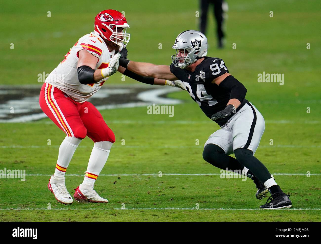Kansas City Chiefs offensive tackle Mike Remmers #75 blocks Las Vegas Raiders defensive end Carl ...