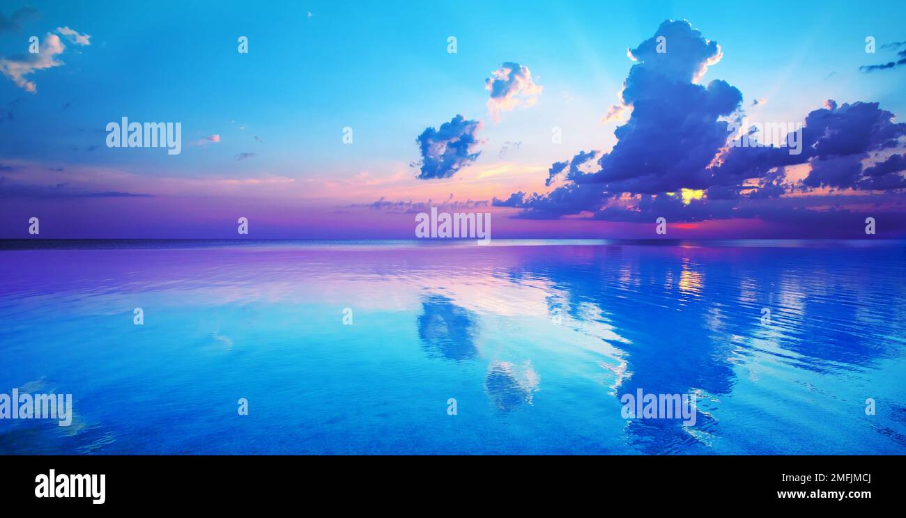 Seascape in the early morning. Beautiful sunrise over the calm sea ...