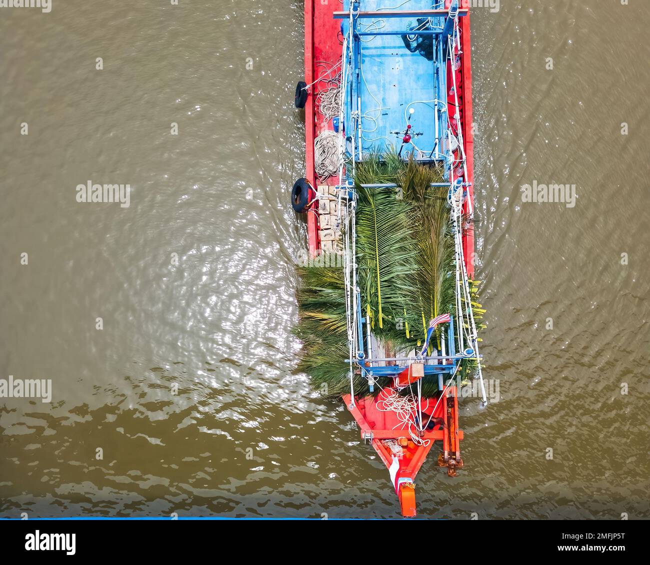 A top view of a boat moving through the river with leaves on it Stock ...