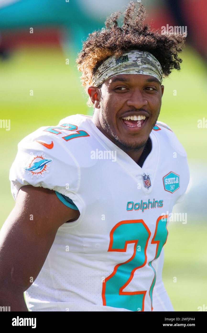 Miami Dolphins safety Eric Rowe (21) stretches on the field while ...