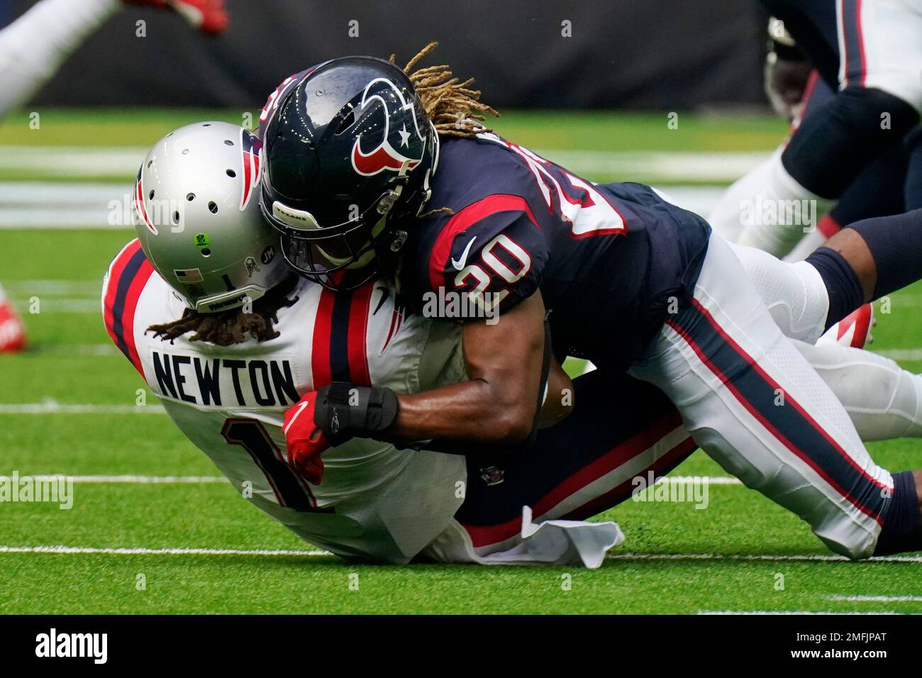 New England Patriots quarterback Cam Newton (1) is sacked by Houston ...
