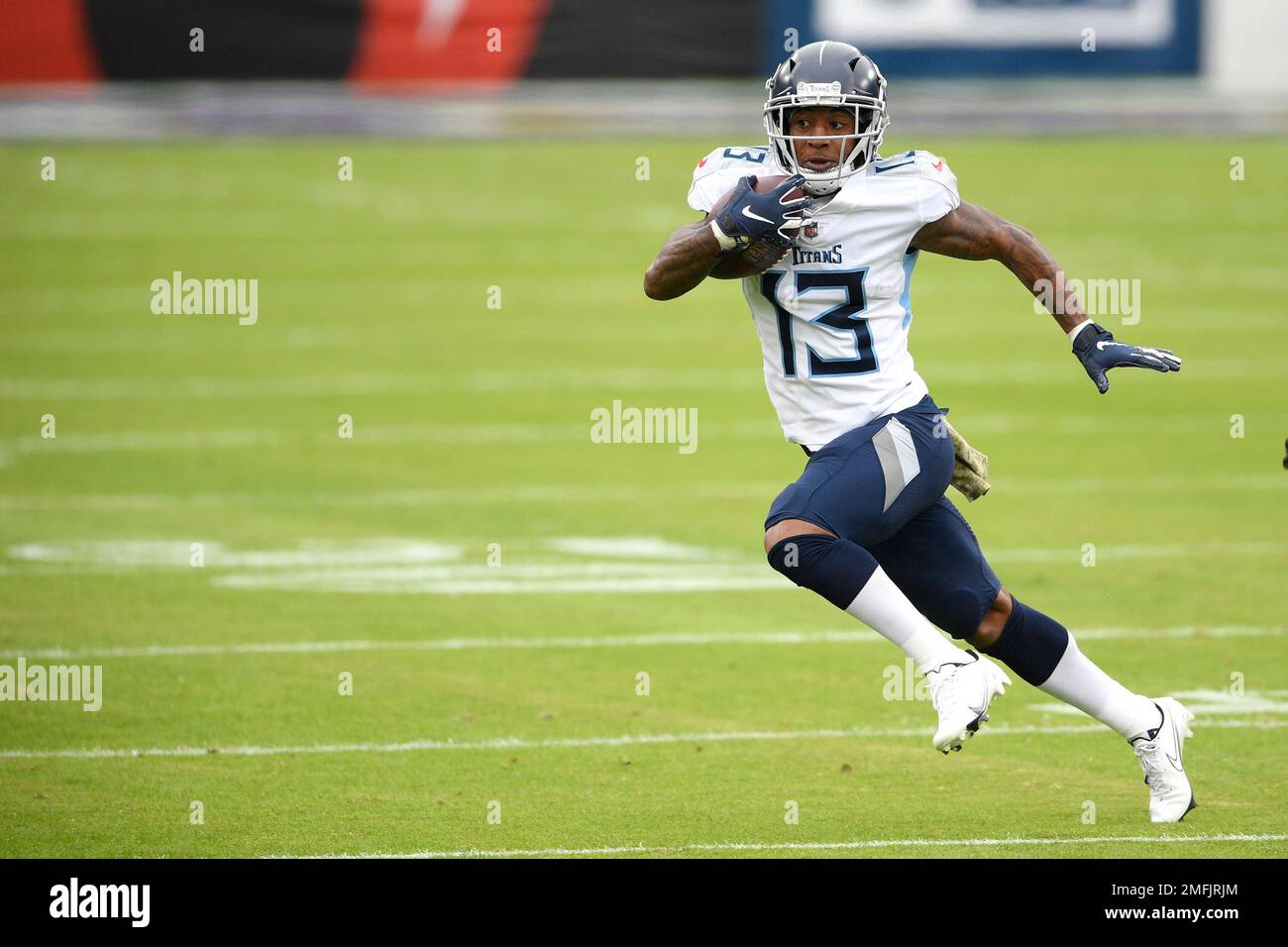 Tennessee Titans wide receiver Cameron Batson runs with the ball ...