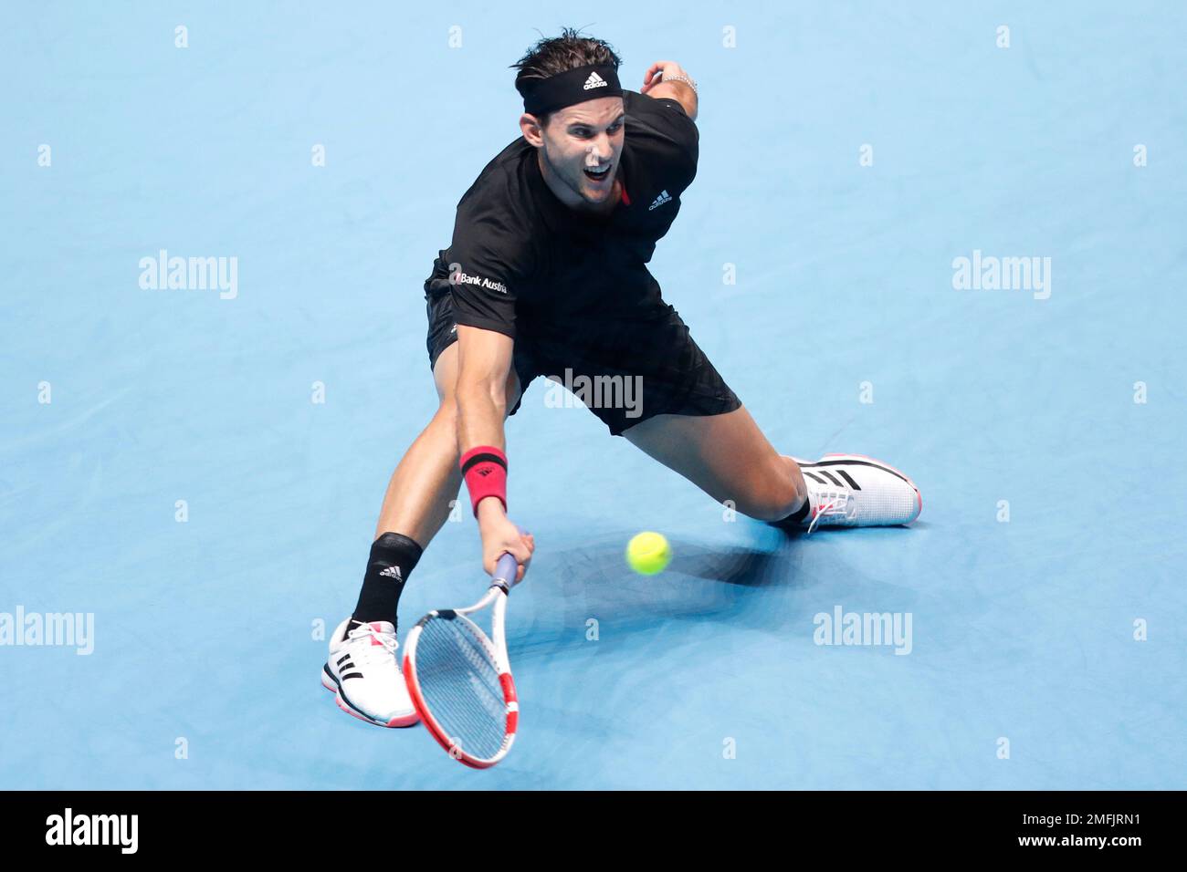 Dominic Thiem of Austria plays a return to Daniil Medvedev of Russia ...