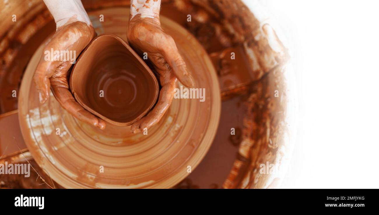 Master making a pot on pottery wheel, top view,banner Stock Photo - Alamy