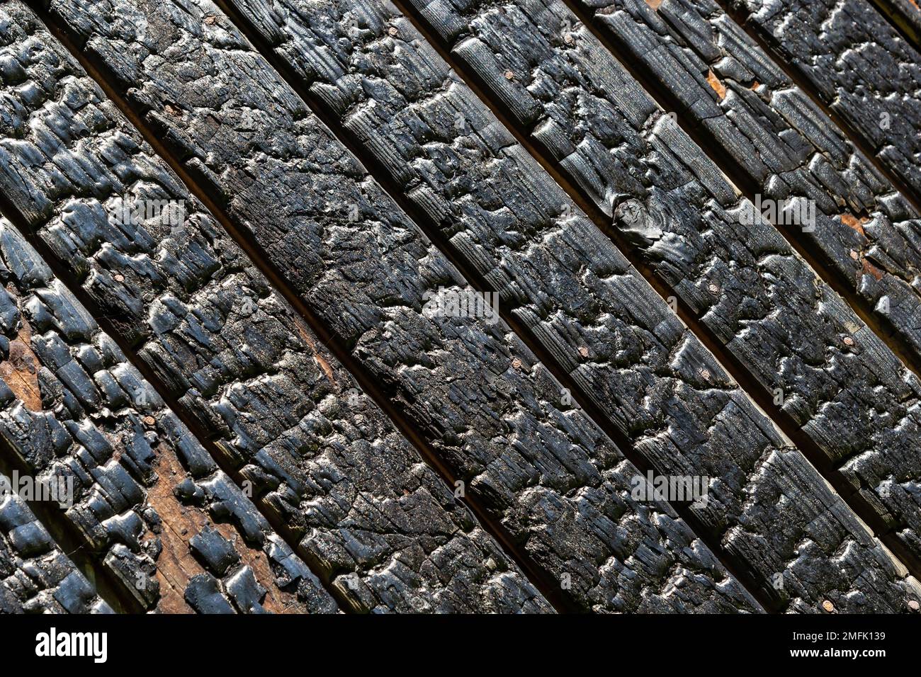 Black wooden board texture, close up. BBQ background. Burnt wooden ...