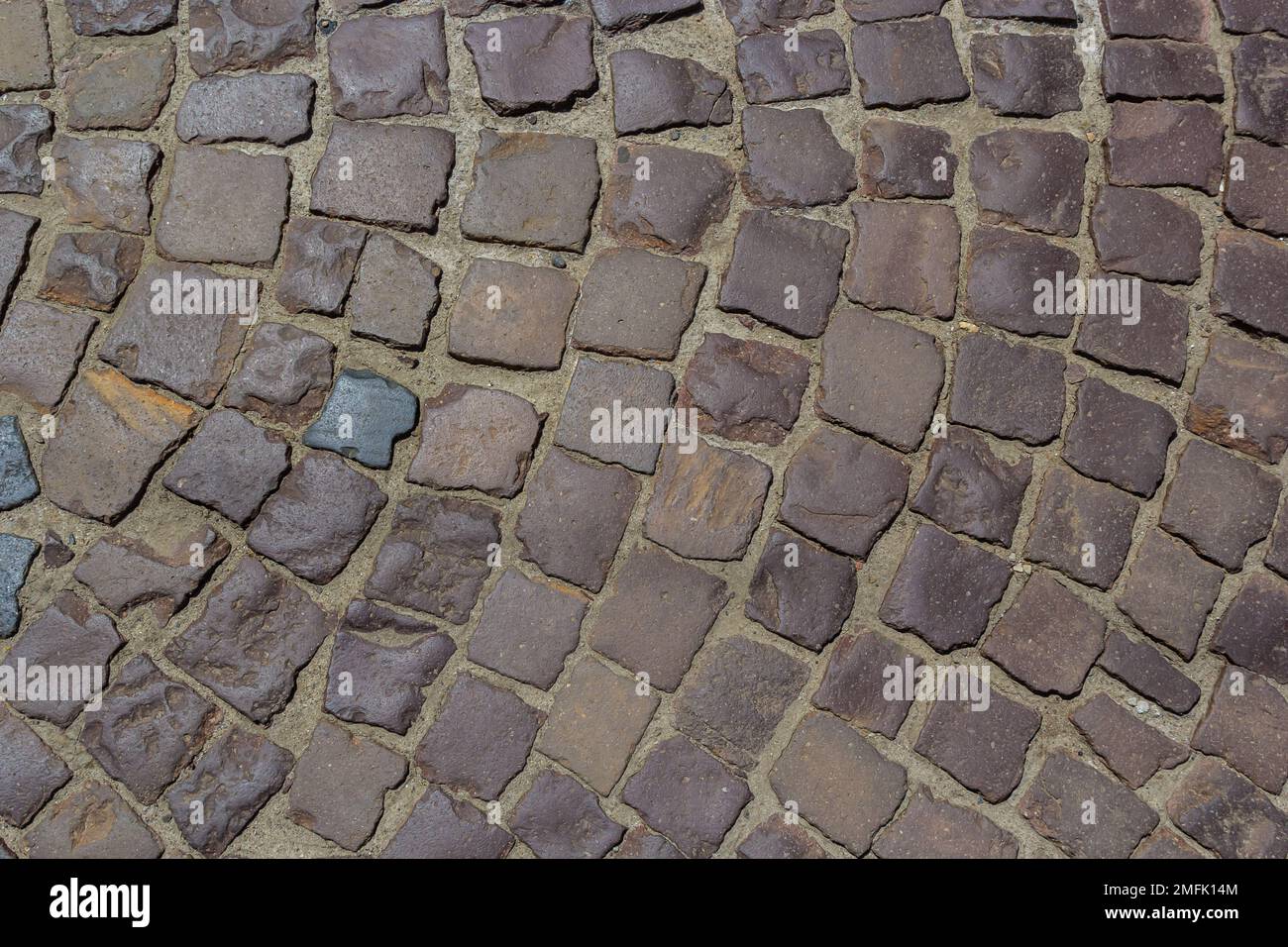 Granite dirty paving stones in the city. Road from paving stones for ...