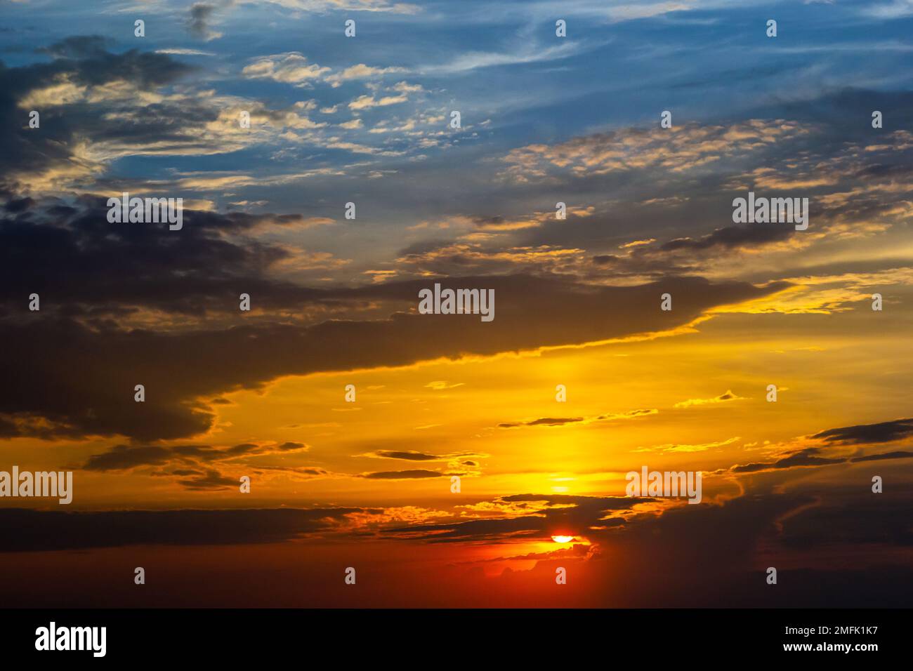 sunset sky with multicolor clouds. Dramatic twilight sky background Stock Photo - Alamy