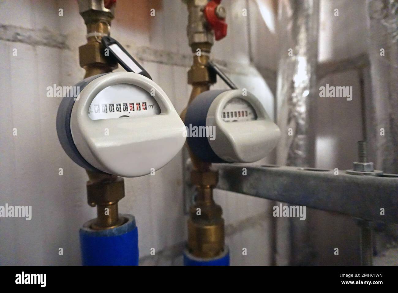 Hot and cold water flow meters installed on pipes Stock Photo - Alamy