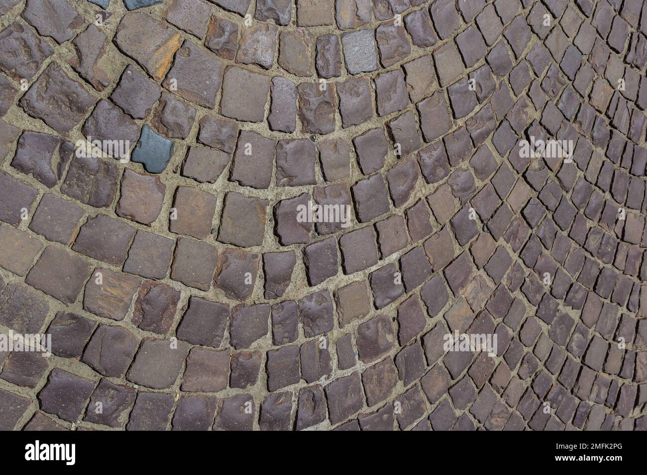 Granite dirty paving stones in the city. Road from paving stones for ...