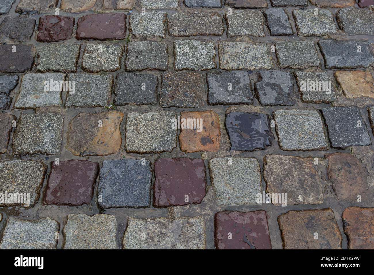 Granite dirty paving stones in the city. Road from paving stones for ...