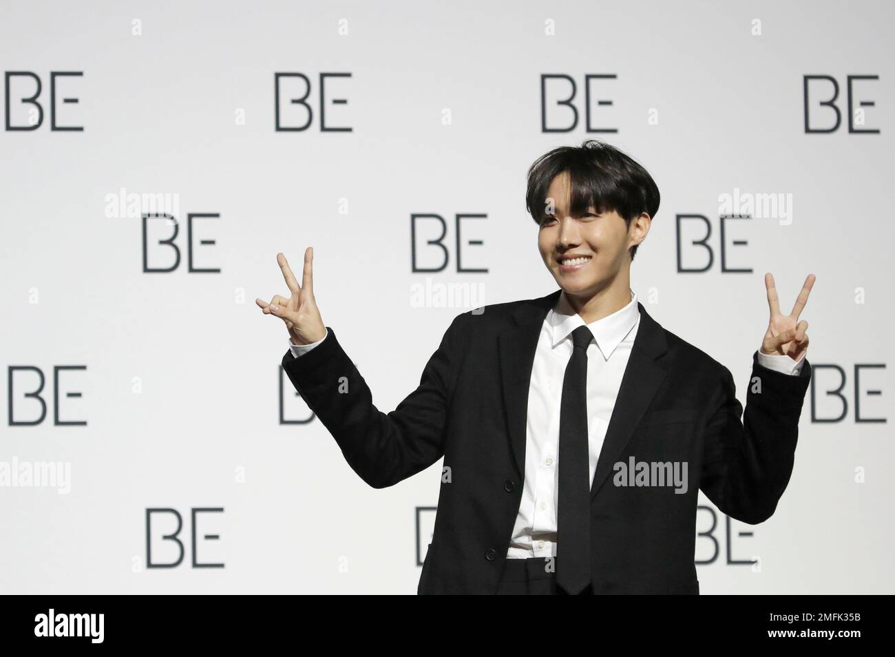 A member of South Korean K-pop band BTS, J-Hope poses for photographers ...