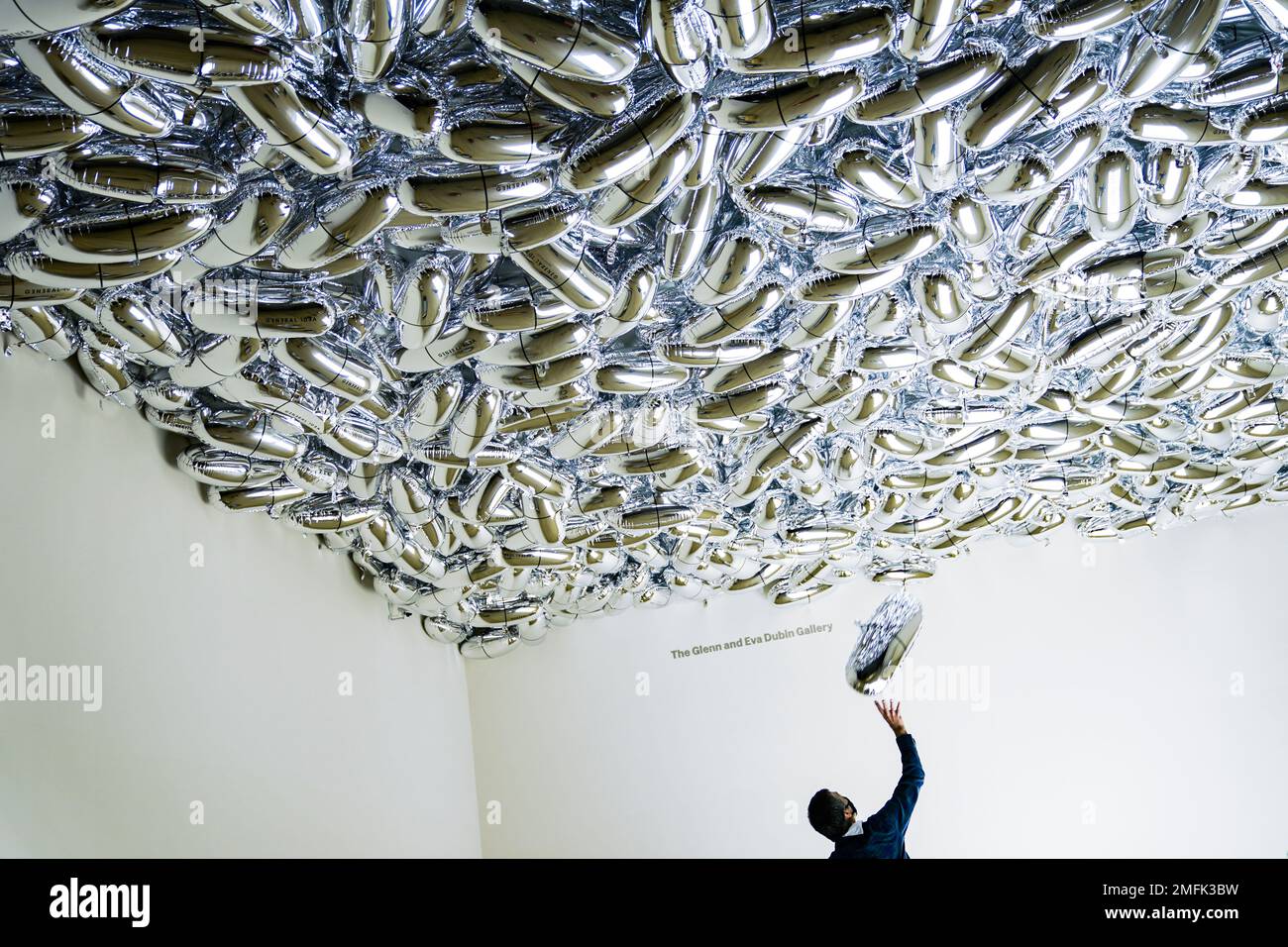 Workers put the finishing installation touches on artist General Idea's ...
