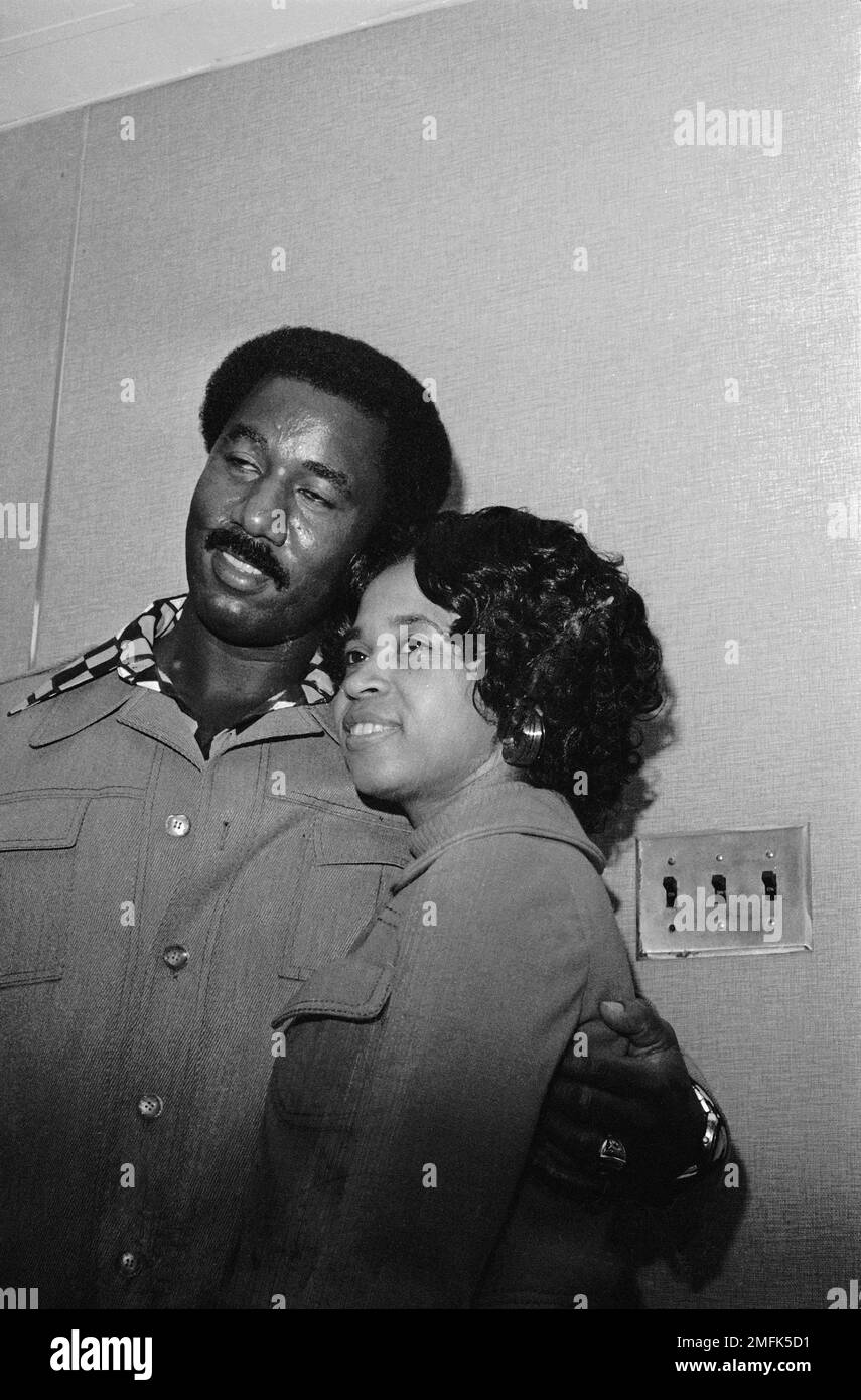New York Mets outfielder Cleon Jones, center, embraces his wife Angela at a press conference in ...
