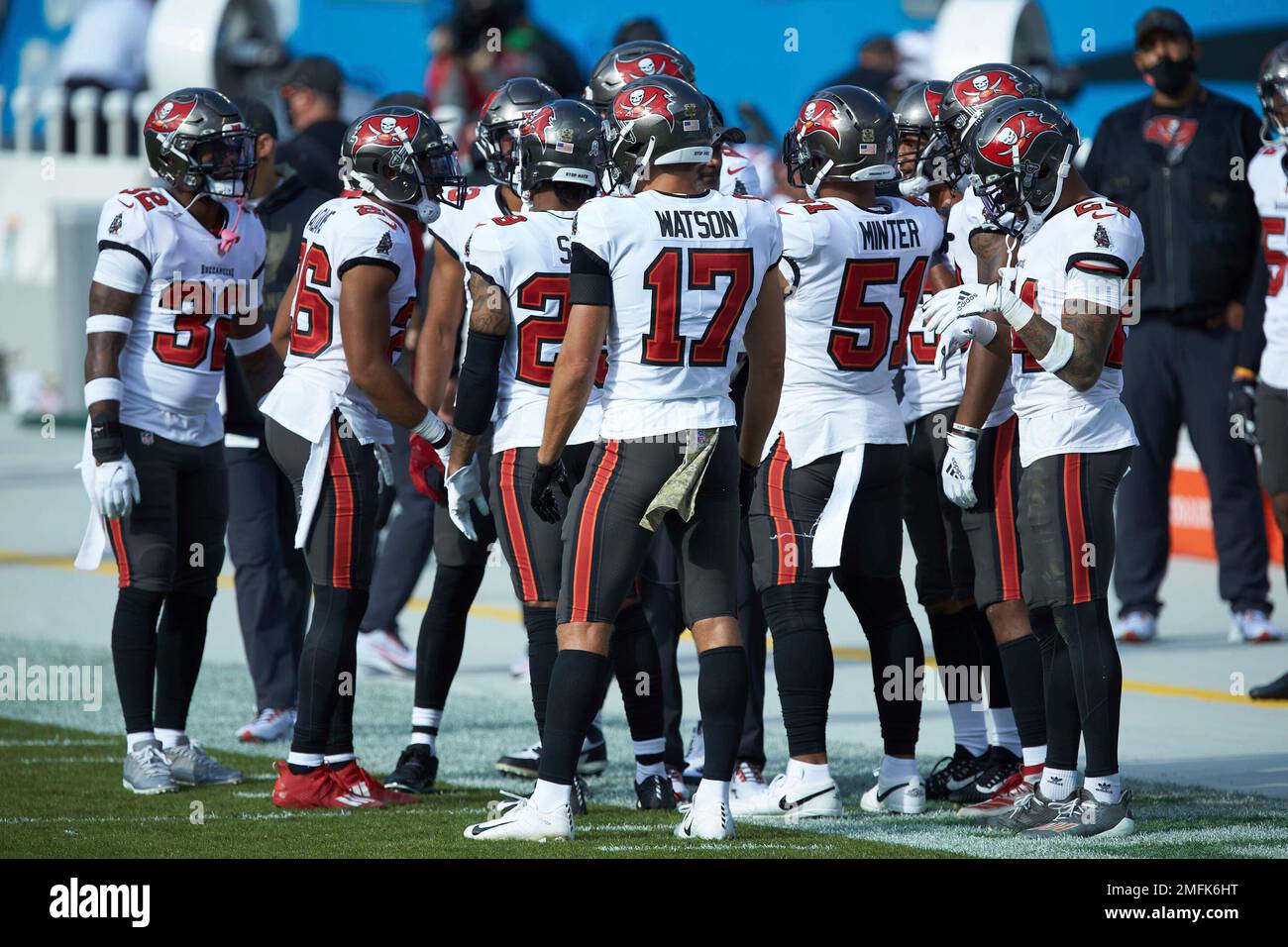 The Tampa Bay Buccaneers huddle up during an NFL football game against ...