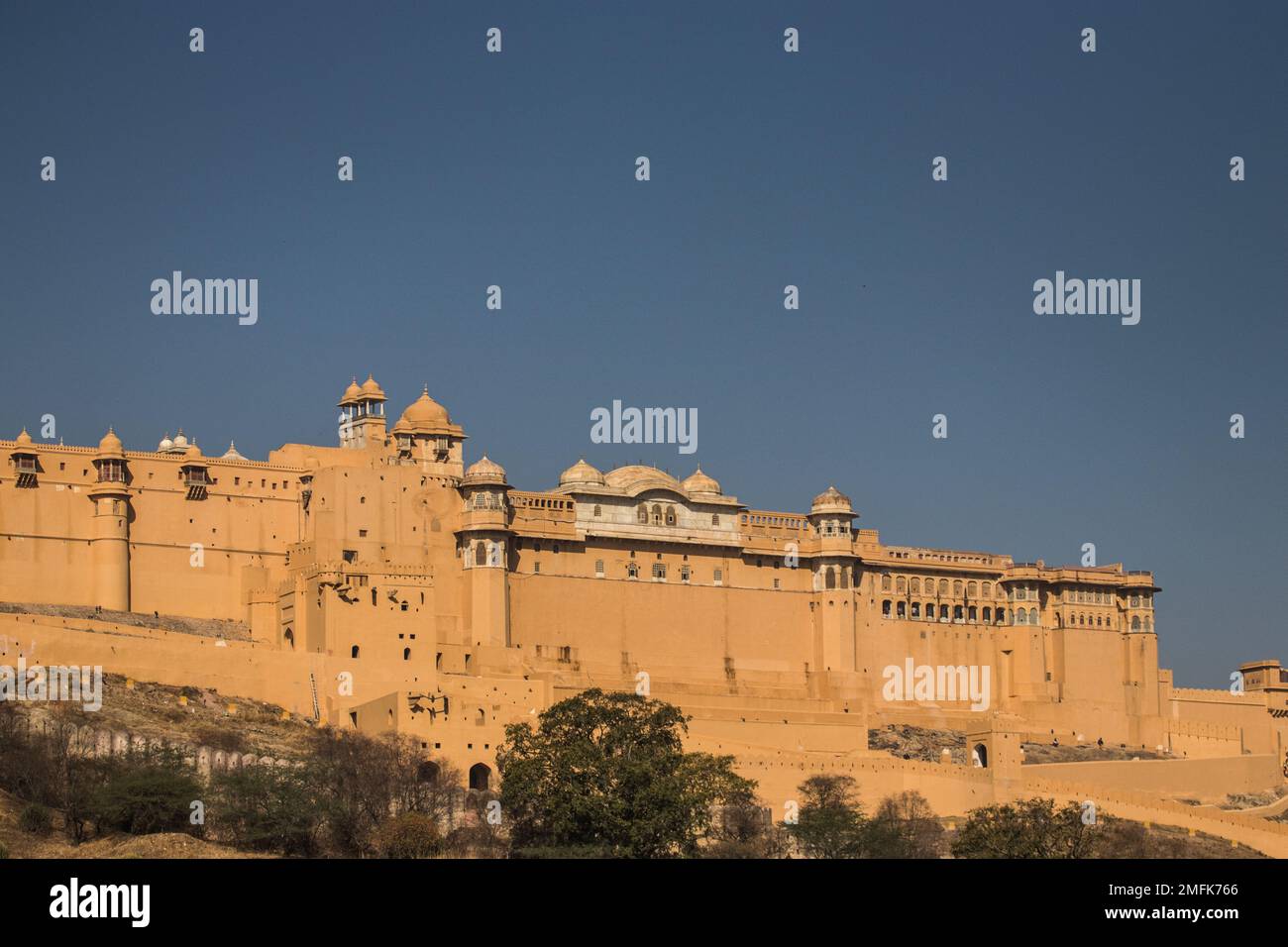 A beautiful scene of the Amber Palace illuminated by sun rays ...