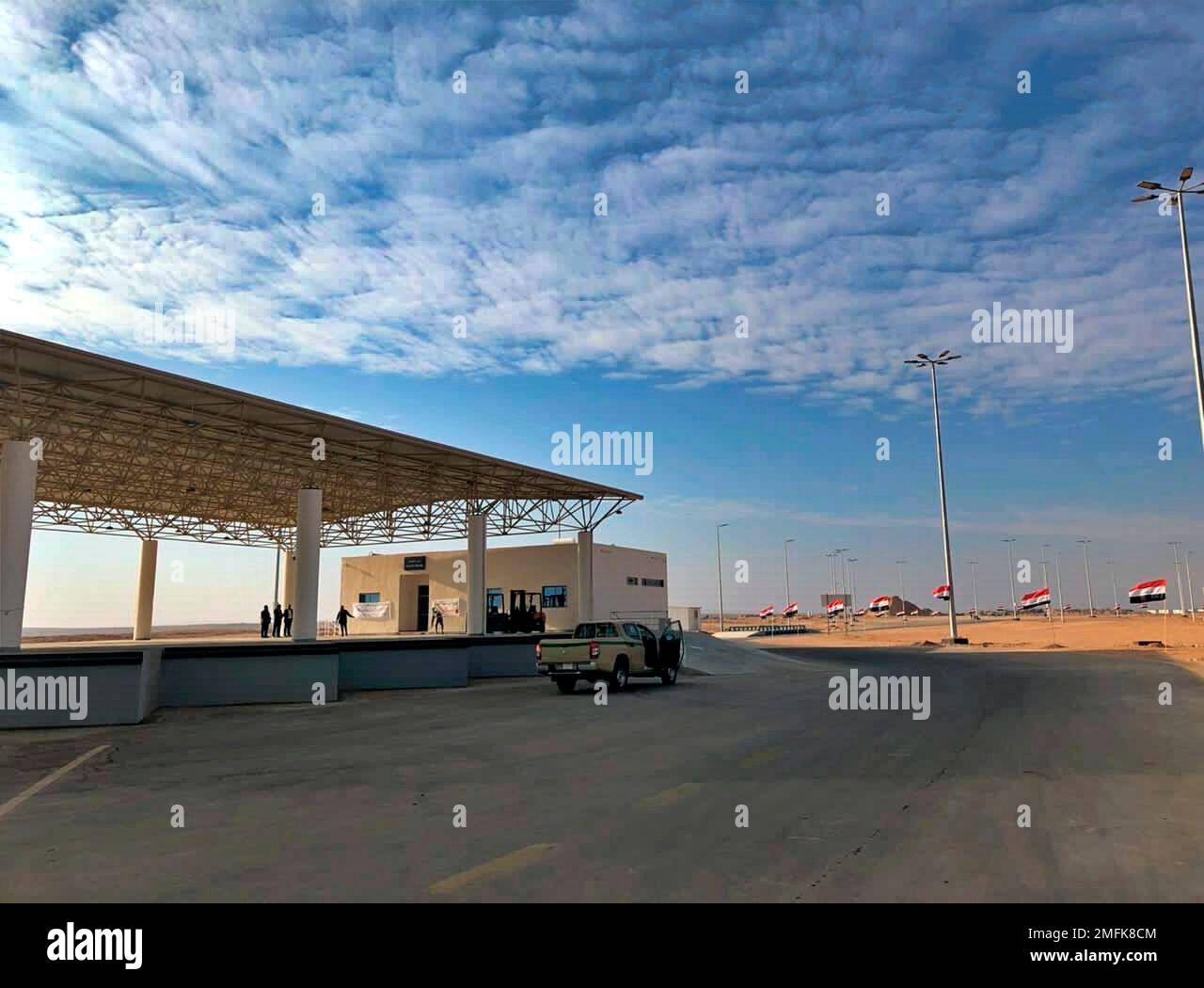 Iraqi security forces stand guard at the Iraqi side of the Arar border ...