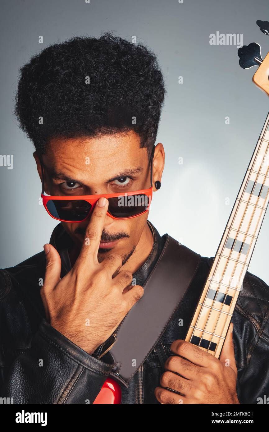 Handsome Black Musician Man With Leather Jacket Holding Bass. Portrait ...