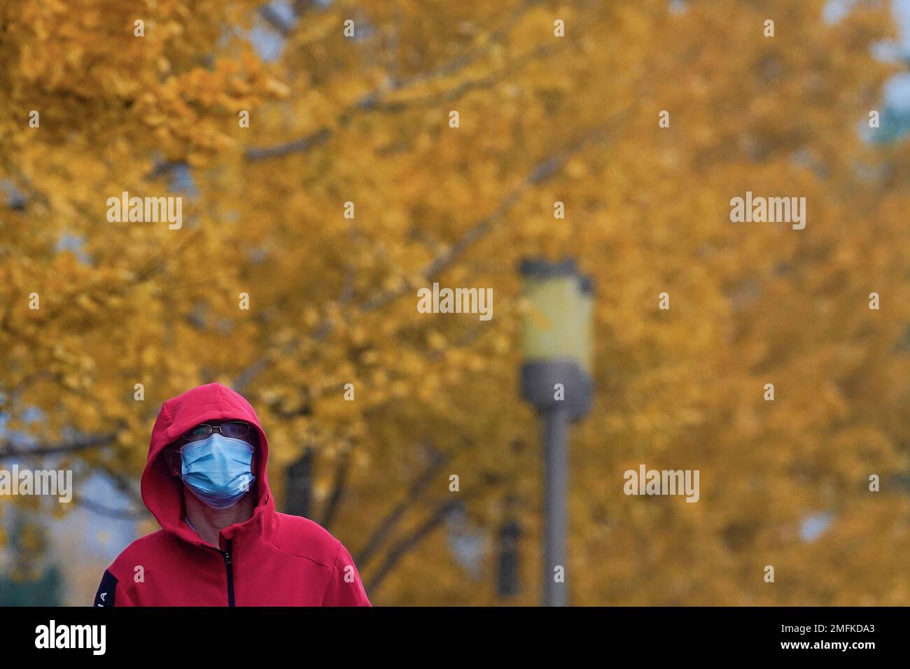 A man wearing a face mask to help curb the spread of the coronavirus ...