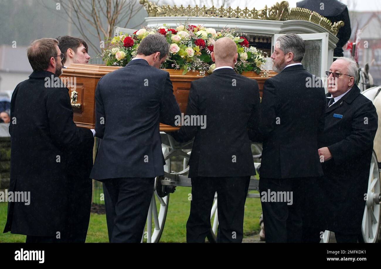 The bearer party, including father Tim Edwards (second right), carry ...