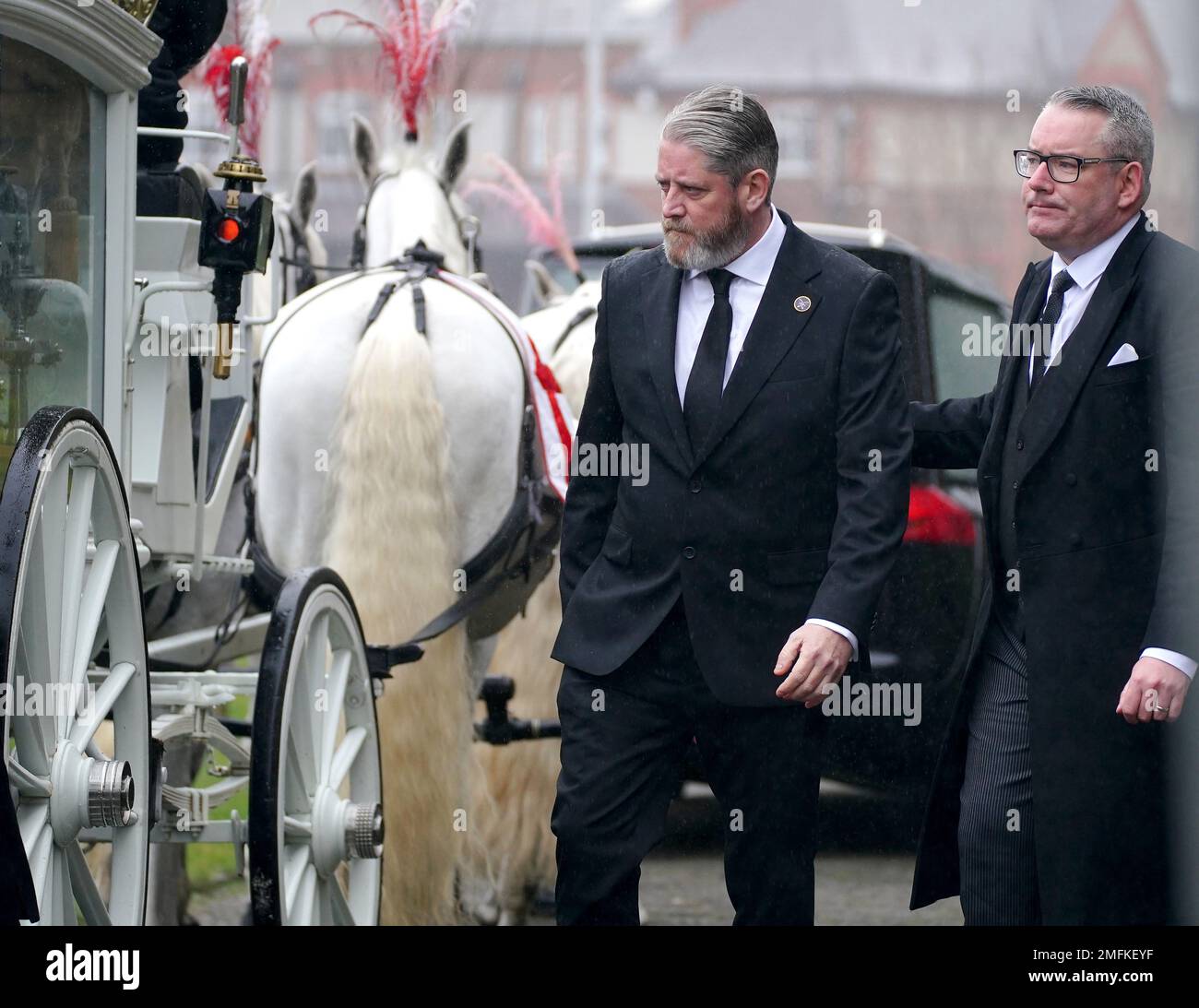 Elle Edwards' father, Tim Edwards, walks to join the bearer party to ...