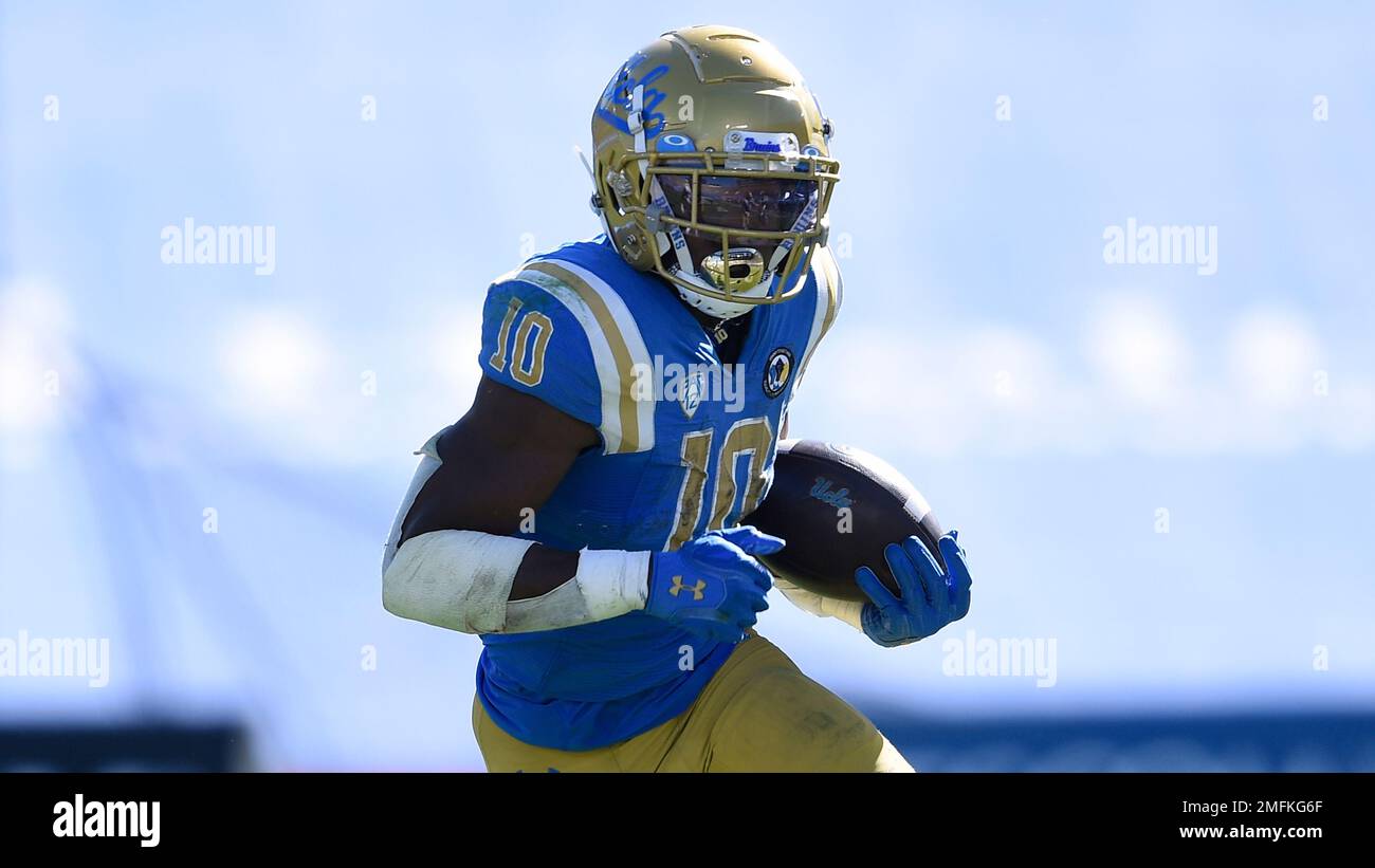 UCLA running back Demetric Felton runs the ball during the second half ...