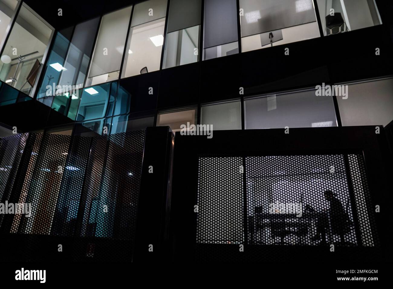 A woman sits as she works at a desk of an insurance company office, in ...
