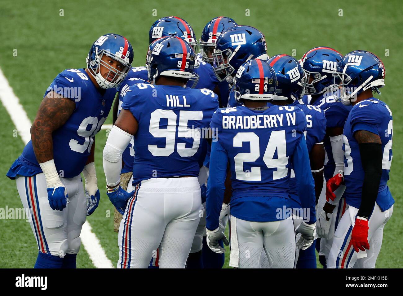 New York Giants nose tackle Austin Johnson (98) listens in during an ...