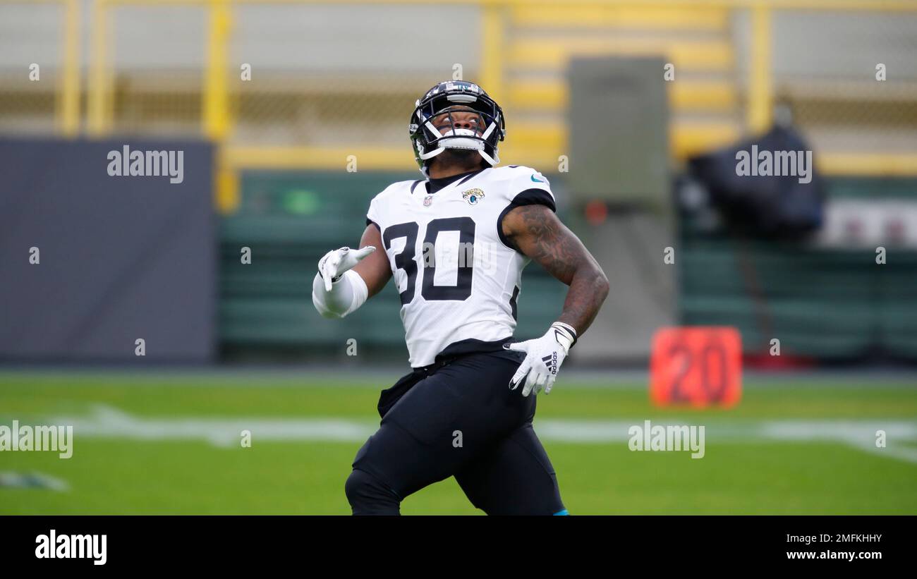 Jacksonville Jaguars' James Robinson warms up before an NFL football ...