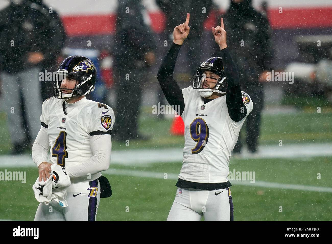 Baltimore Ravens kicker Justin Tucker, right celebrates a successful ...