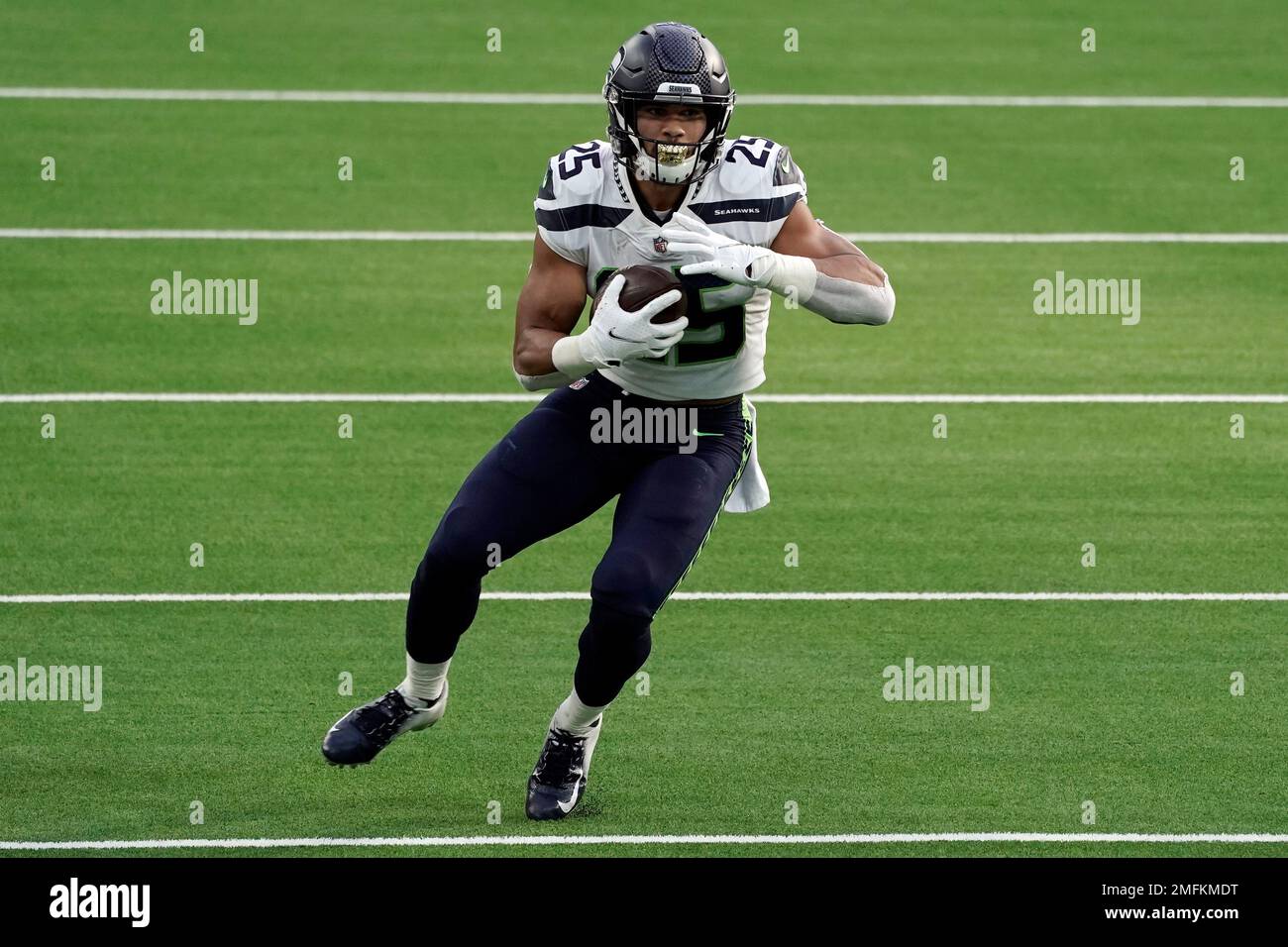 Seattle Seahawks running back Travis Homer carries against the Los ...
