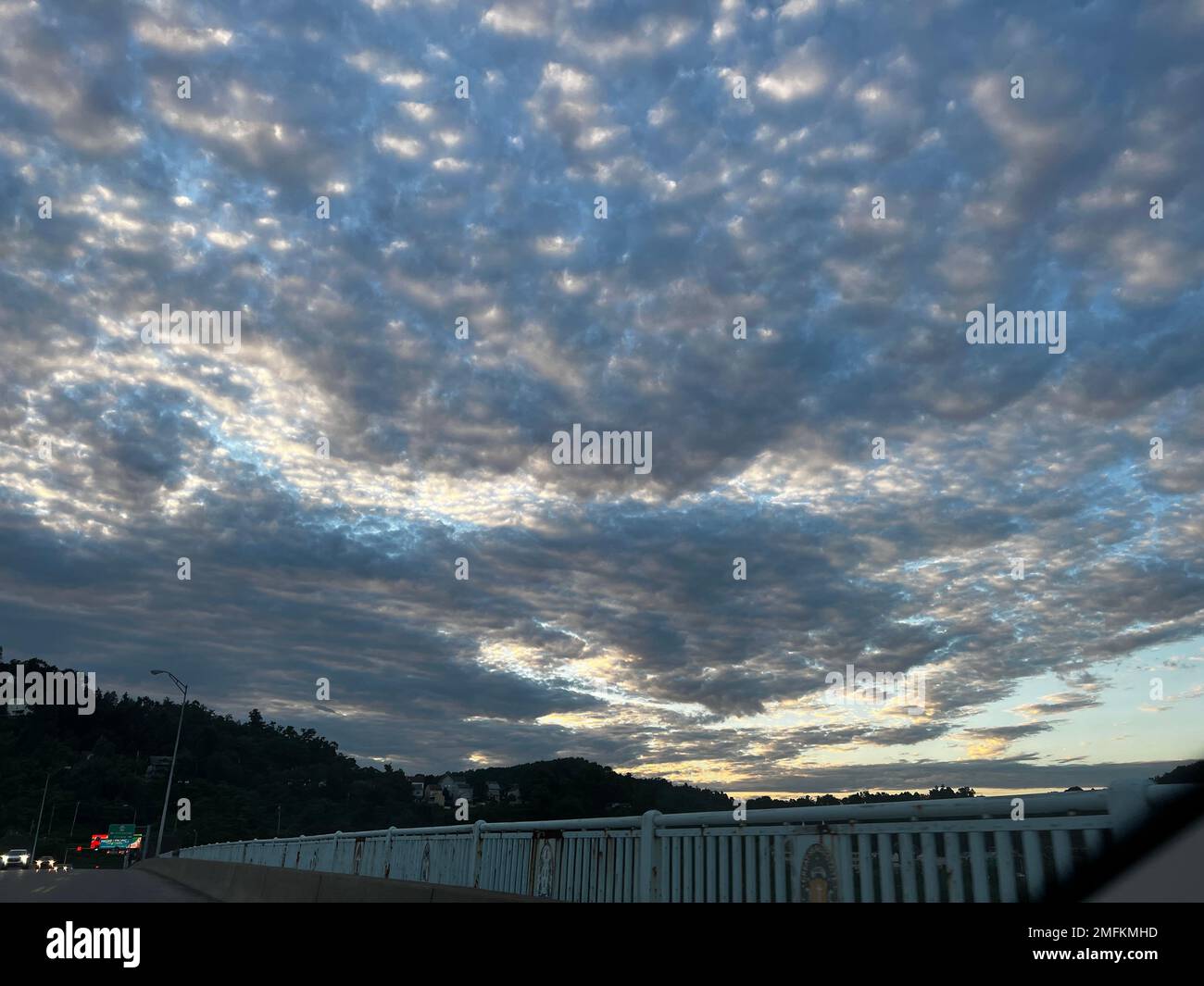 The beautiful Clouds in the sky seen from a bridge Stock Photo - Alamy