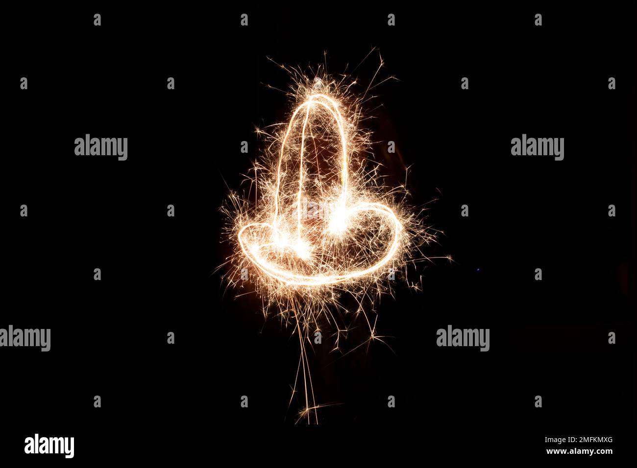 Different figures, letters or drawings created at night with flares ...