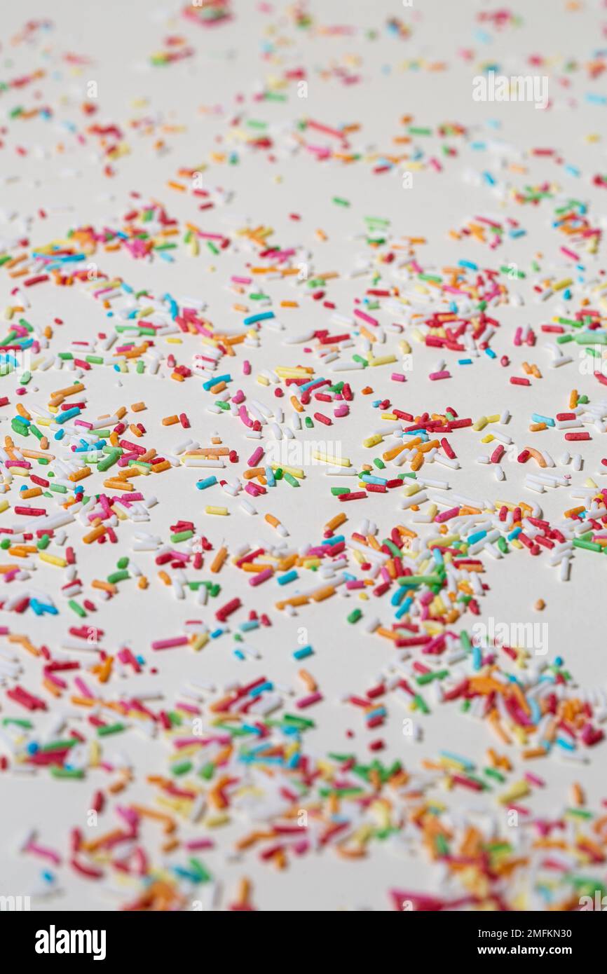 Photo of confectionery sprinkles on a light background. Texture ...