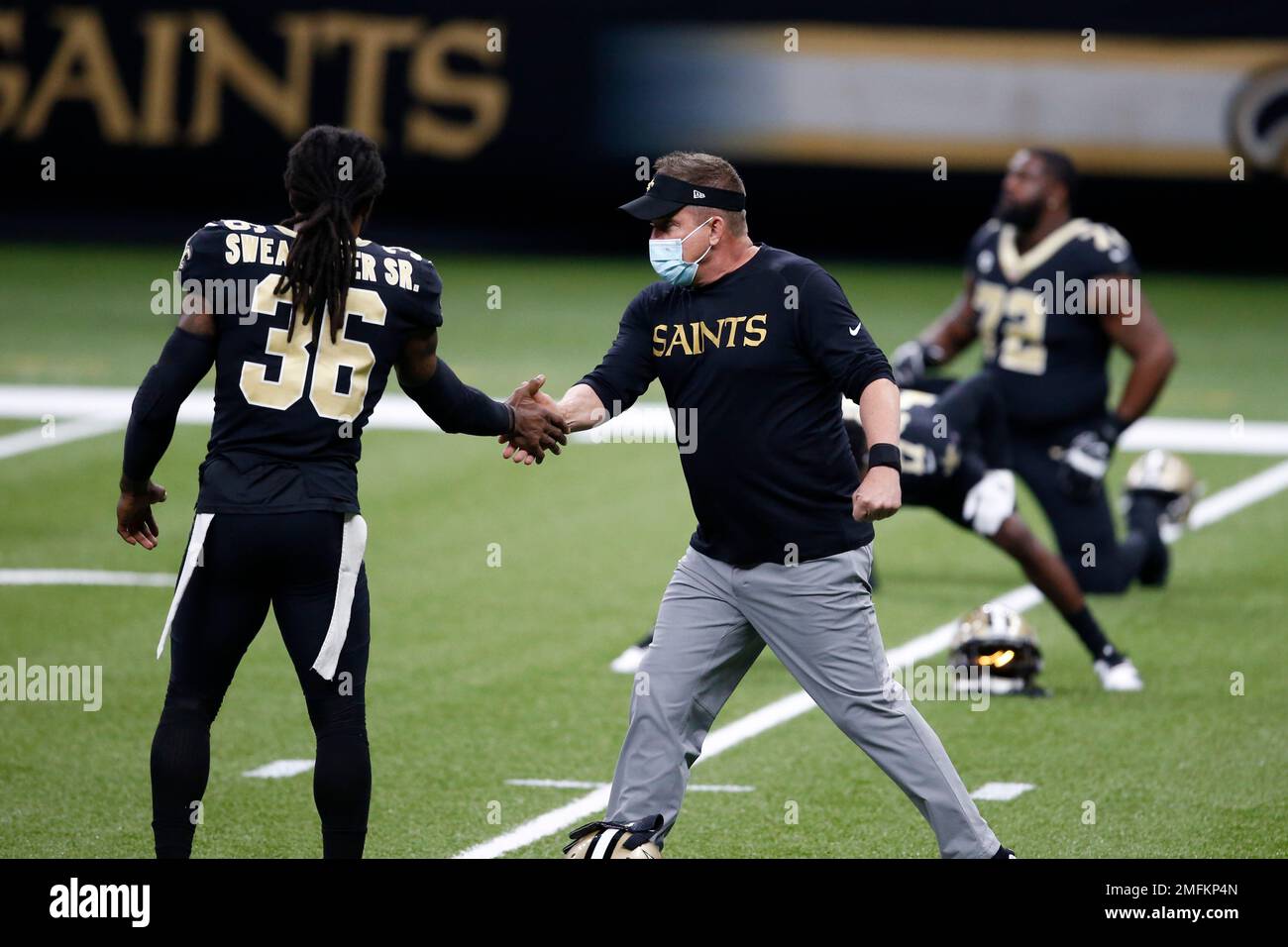 New Orleans Saints head coach Sean Payton greets free safety D.J ...